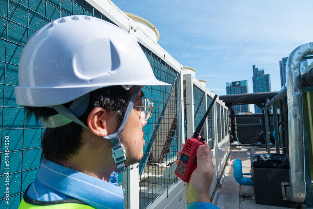 Engineer under checking the industry chilled water fan coil unit air ...