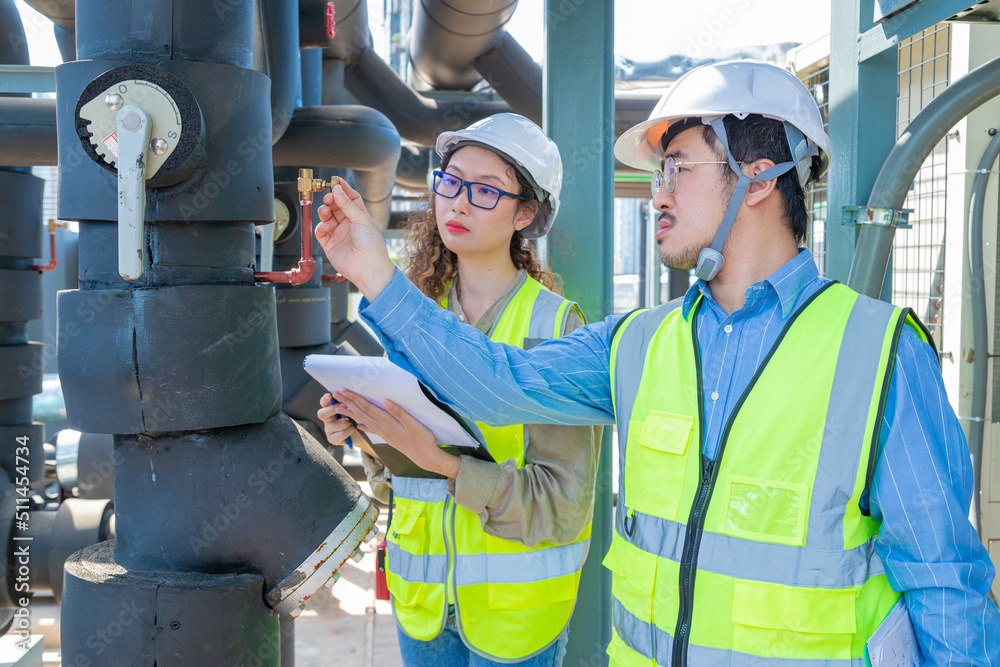 Engineer under checking the industry chilled water fan coil unit air ...
