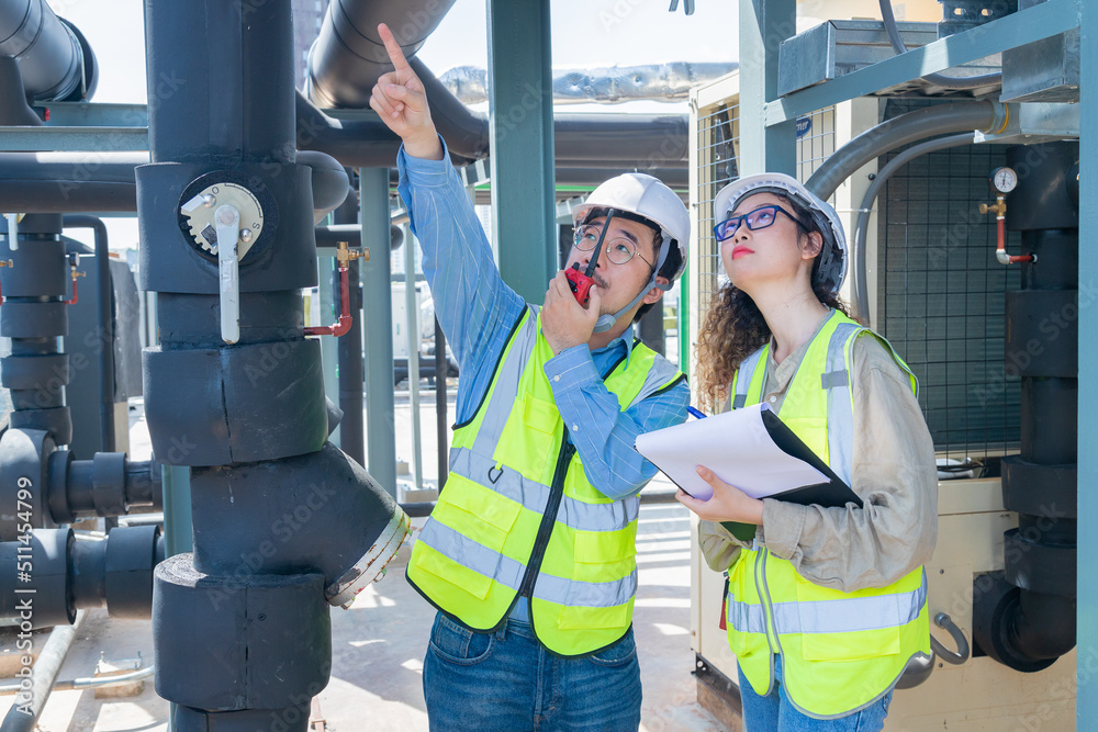 Engineer under checking the industry chilled water fan coil unit air ...