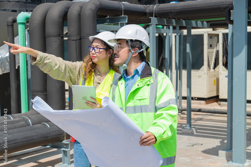 Engineer under checking the industry chilled water fan coil unit air ...