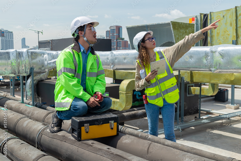 Engineer under checking the industry chilled water fan coil unit air ...