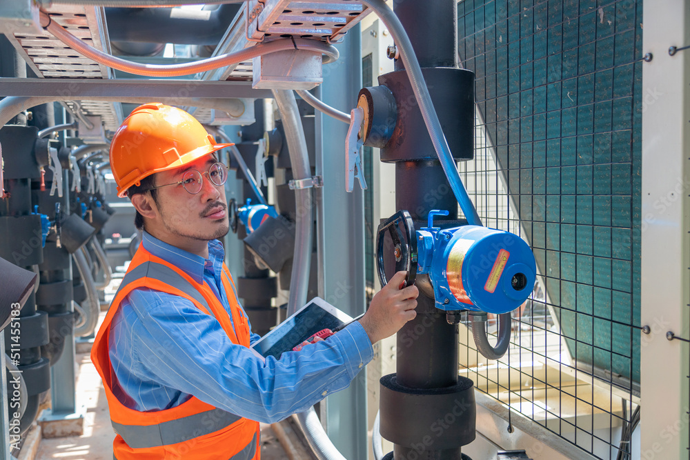 Engineer under checking the industry chilled water fan coil unit air ...