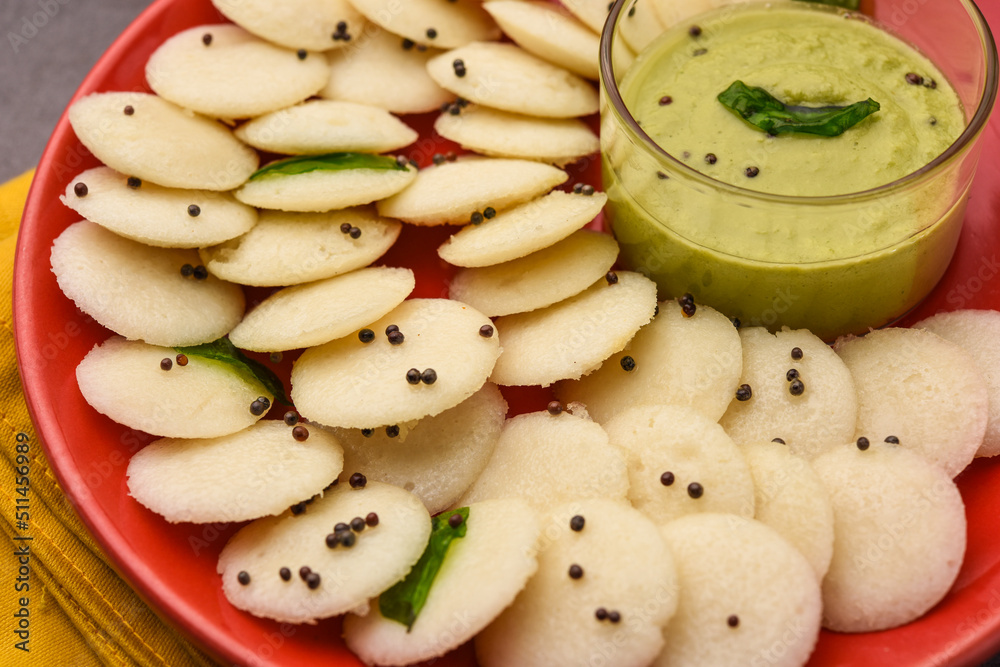 Mini idli is the smaller version of soft and spongy round shaped ...