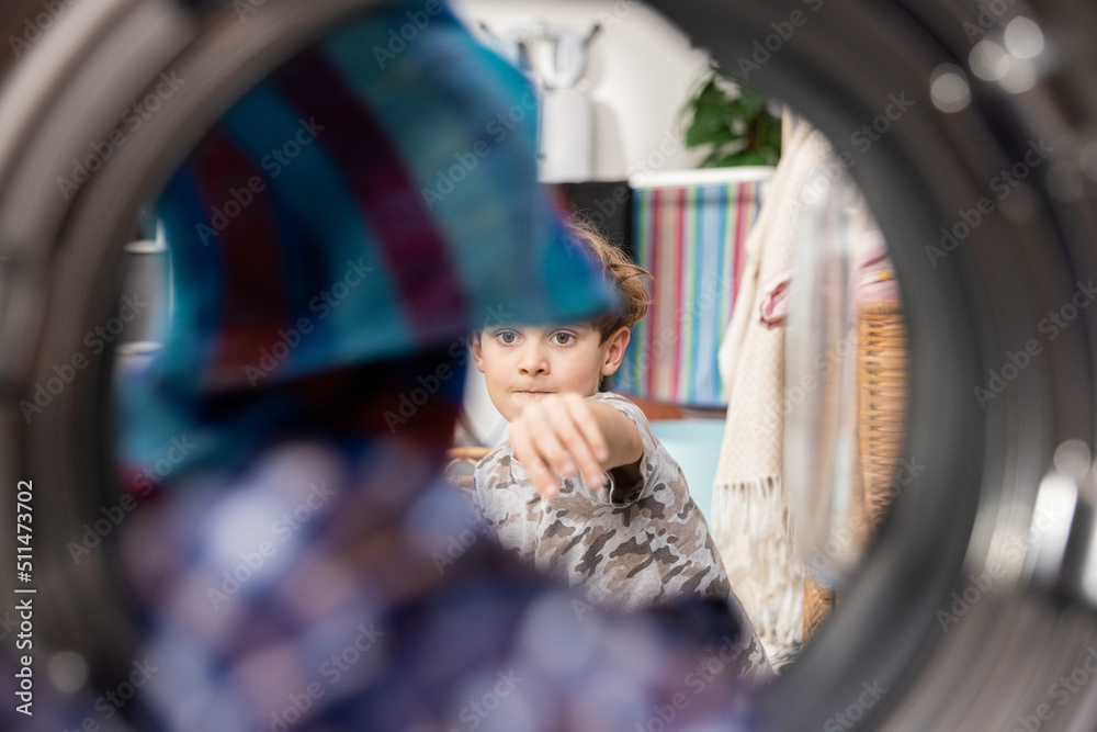 Shot from inside washing machine view of bathroom, laundry room. Little ...
