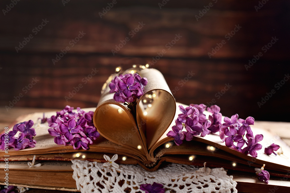 Beautiful background with pages of old book formed in heart shape and ...
