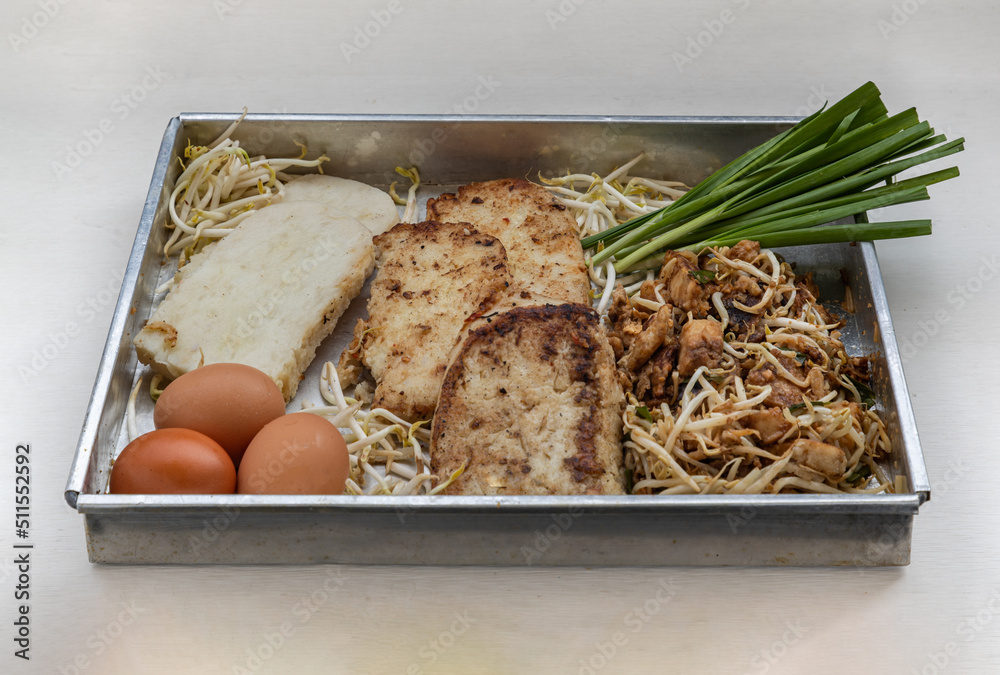 Stir-fried soft turnip cake or Fried radish cake (chai tow kway) with ...