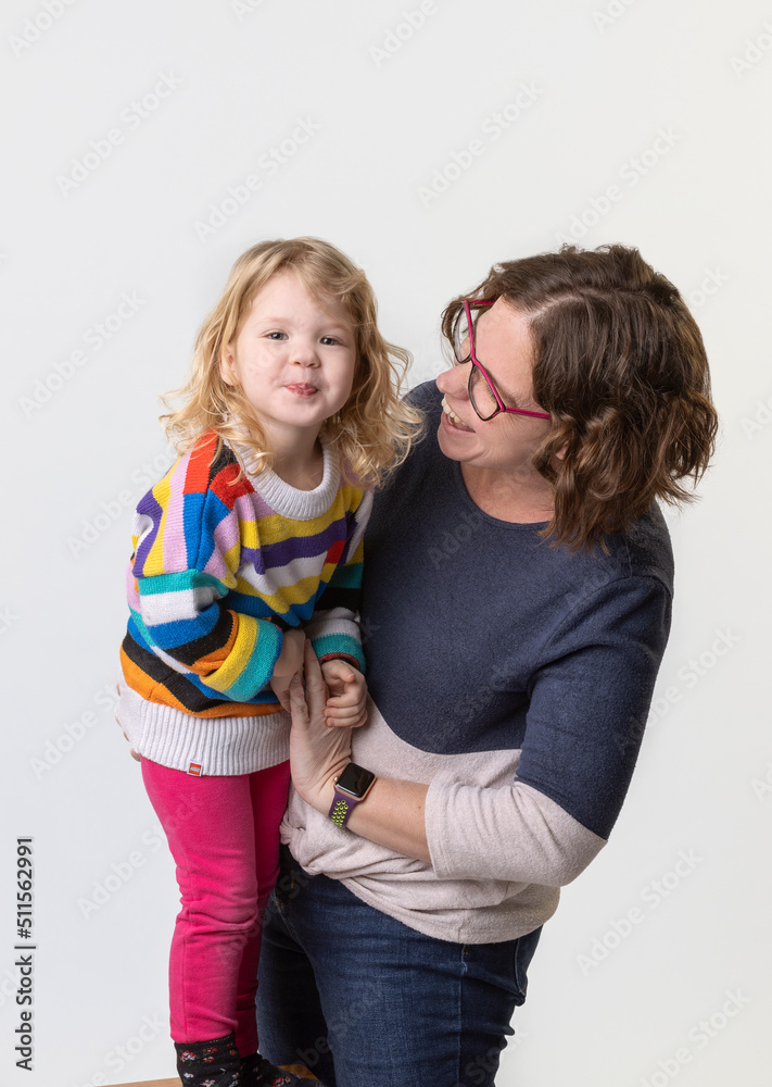 Mother and daughter laughing and being silly during a photo session in ...