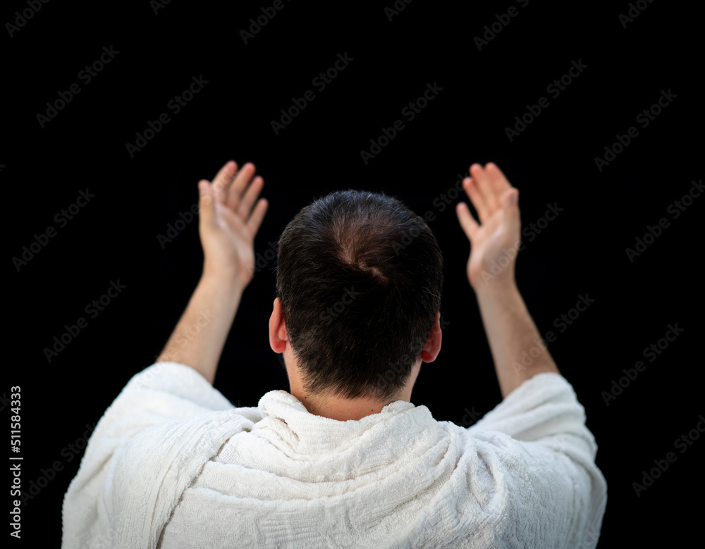 Muslim man standing and praying in the front of Kaaba in Mecca, KSA ...
