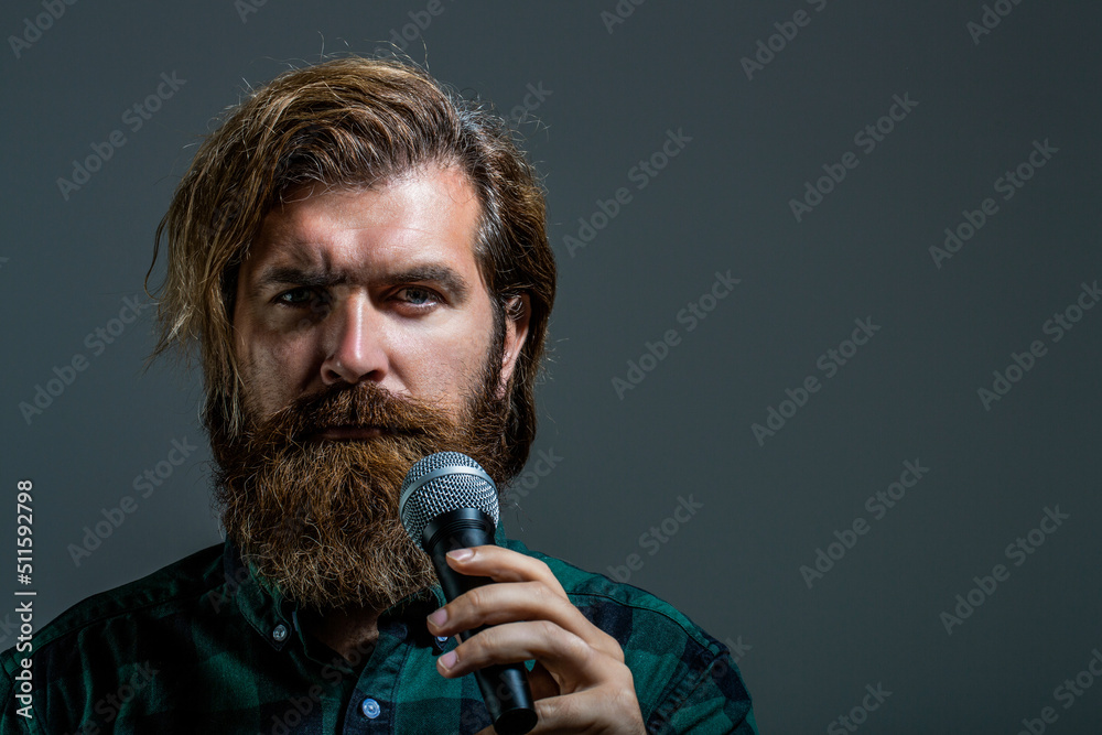 Bearded Man In Karaoke Sings A Song Into A Microphone Male Attends