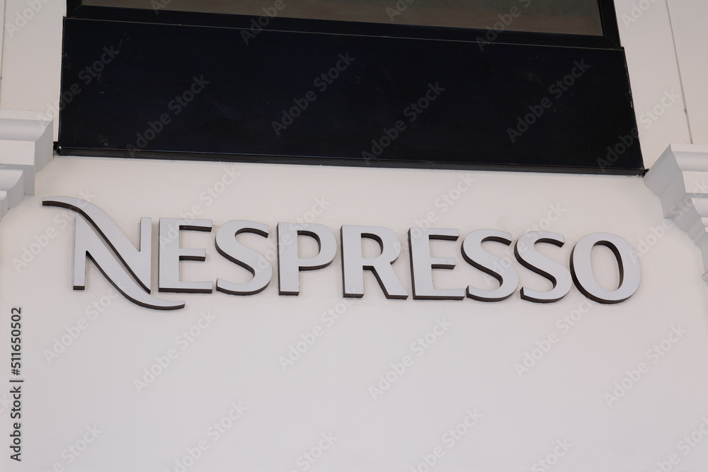 Nespresso logo sign and text brand of coffee machines front wall facade ...
