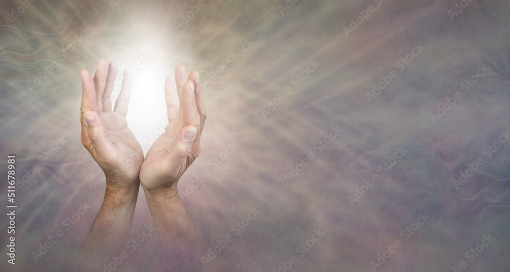 Sending out beautiful gentle healing energy - mature male hands ...