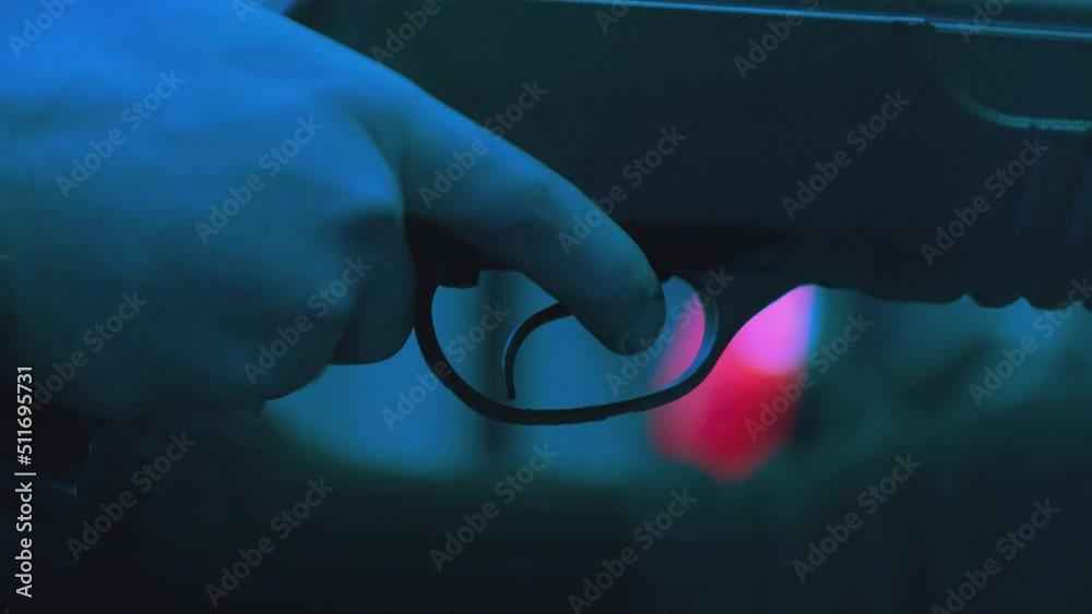 Vídeo do Stock: Weapon shot . Close-up finger pulls the trigger of ...