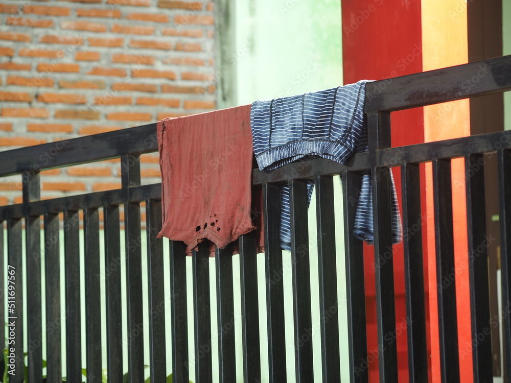 clothes are dried in front of the house on the fence at night, clothes ...