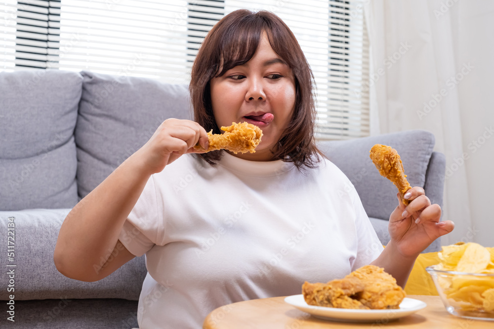 Young Asian oversize women gain weight while eating fried chicken ...