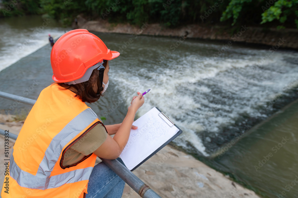 Asian Female engineering working . at sewage treatment plant,Marine ...