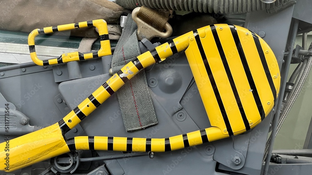 Detail of yellow and black handles, part of ejector seat mechanism in a ...