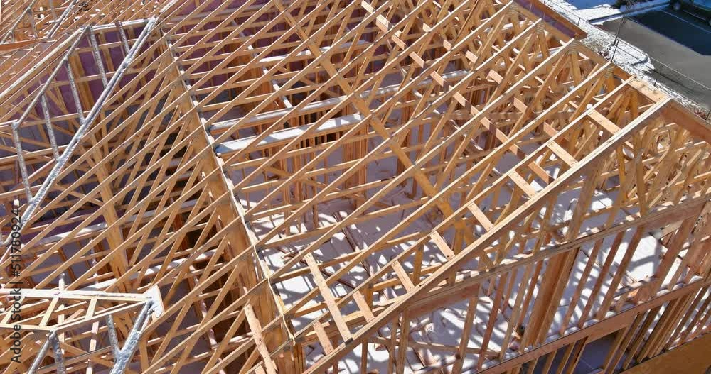 Wooden roof beams trusses system framed construction in new home an ...