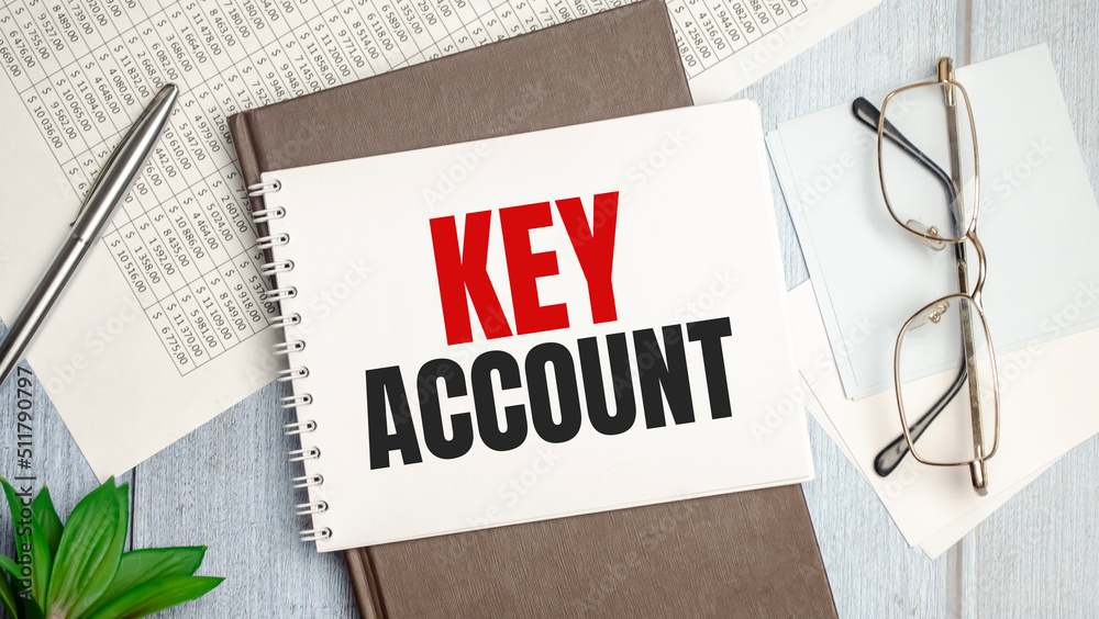 Text KEY ACCOUNT on a notebook on the diagram and charts with ...