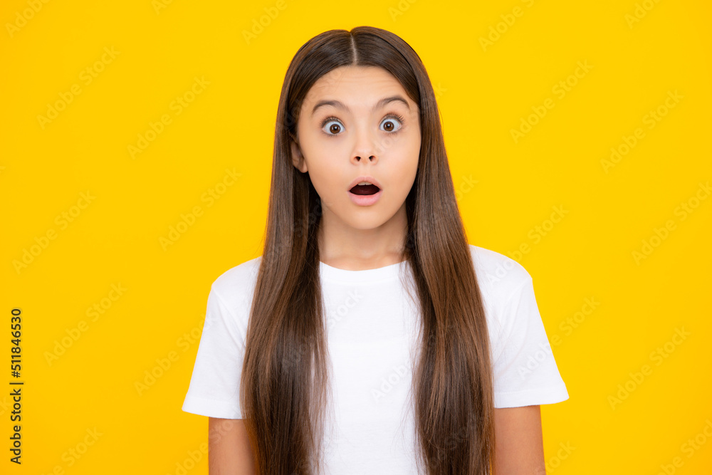 Shocked teenager child portrait isolated on yellow background ...