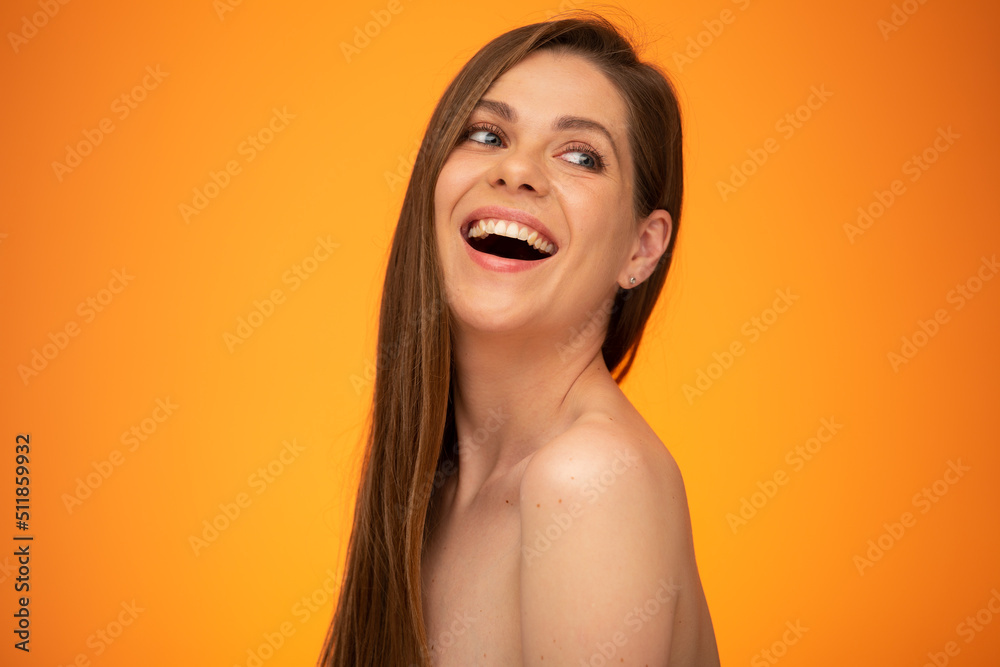 Laughing woman with long hair and bared shoulders looking up. Isolated ...