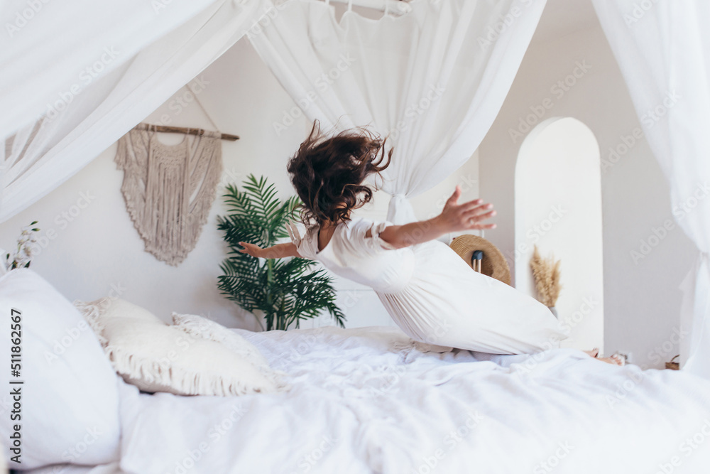 Woman falls on the bed Stock Photo | Adobe Stock