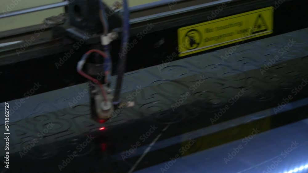 Laser cuts numbers and letters for car numbers on plastic with double ...