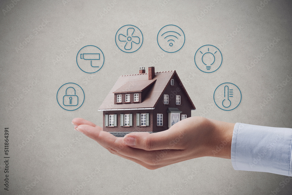 Hands holding a smart home model Stock Photo | Adobe Stock