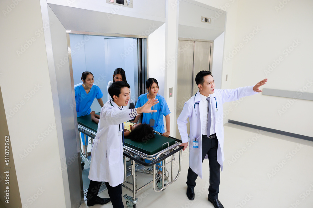 Group of Asian medics or doctors Push Stretcher with Seriously Patient ...