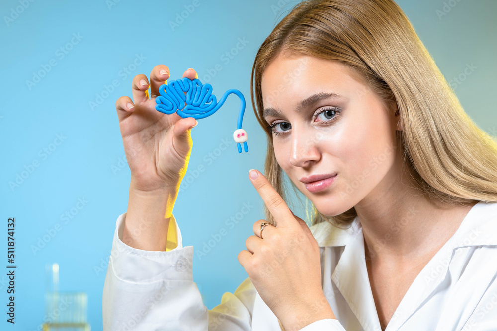 Woman demonstrates brain model. Young neuroscientist girl. Female ...