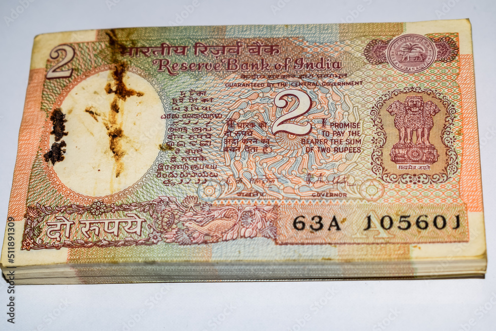 Old Two Rupee notes combined on the table, India money on the rotating ...
