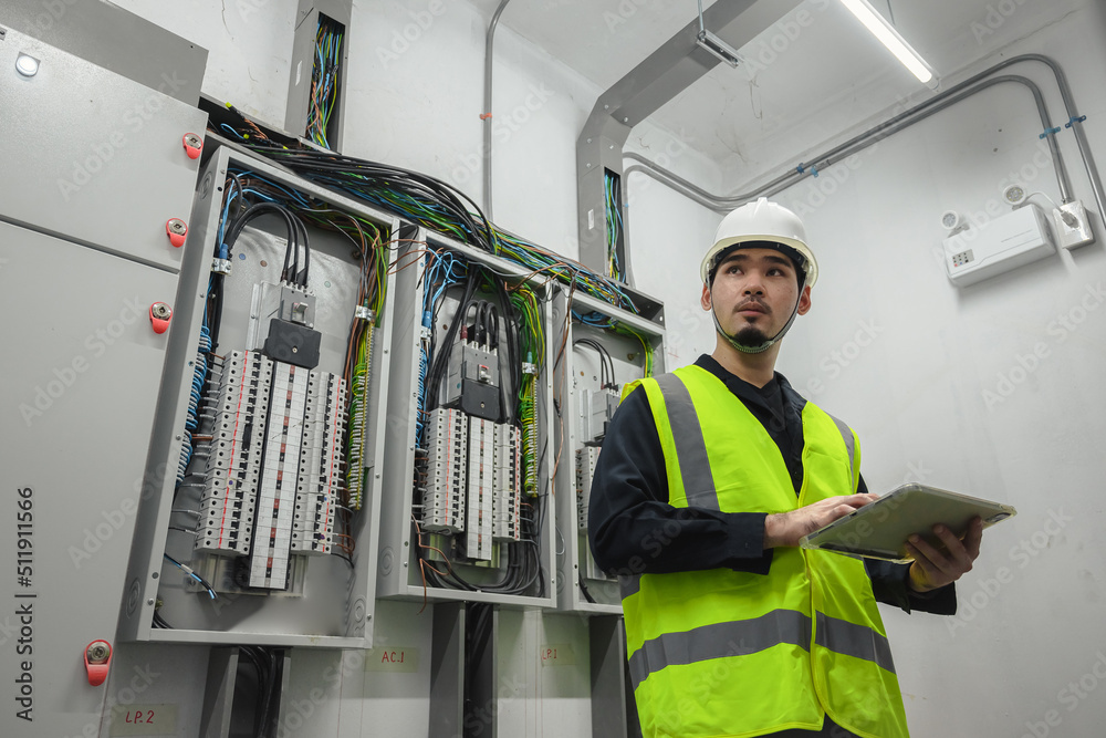 Electrical Engineer team working front control panel, An electrical ...