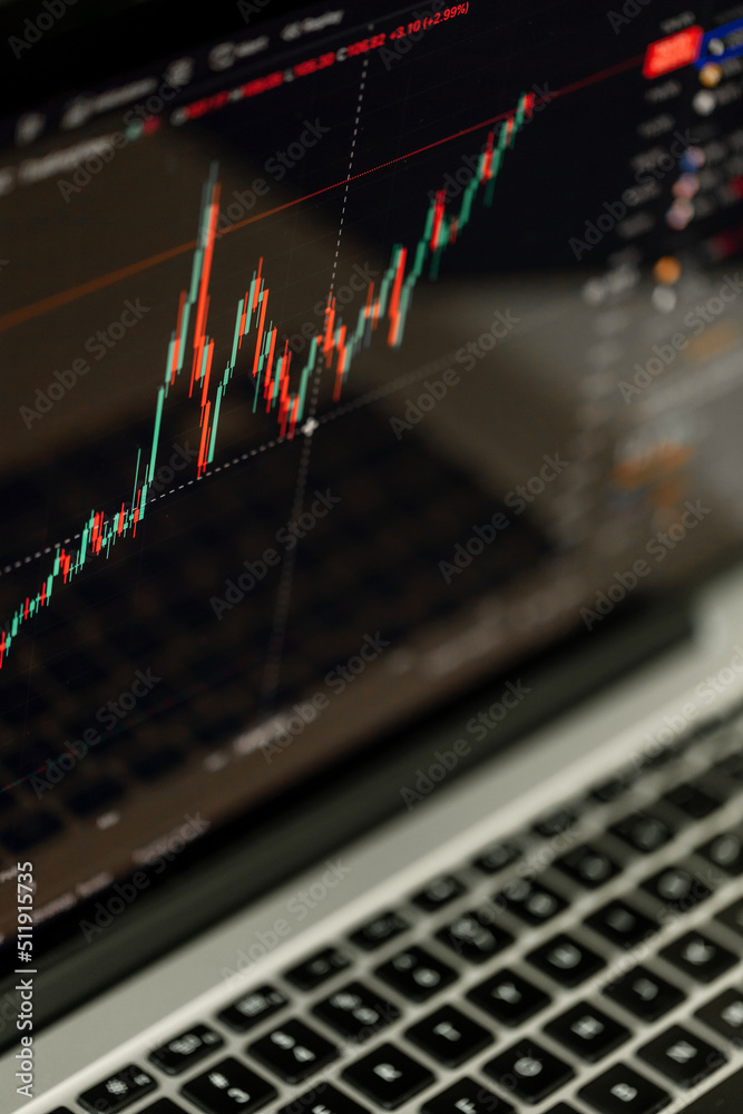 Trading chart displayed on the screen of the laptop. Stock market ...