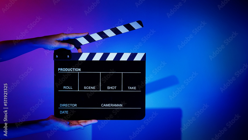 Movie Clapper board. Crew hand holding plastic and wooden film slate ...