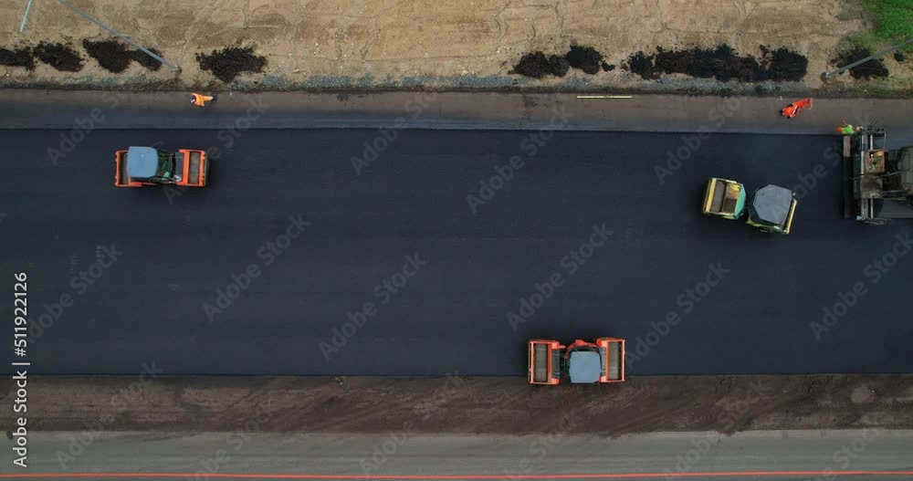 Video Stock Road construction works aerial view. Laying of new asphalt ...