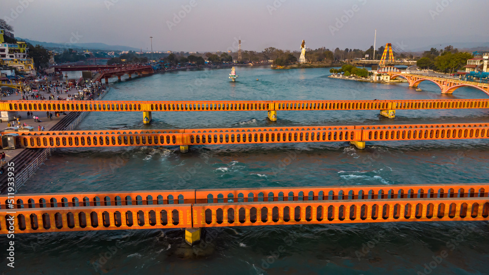 isolated iron bridge many over ganges river with wide view of city at ...