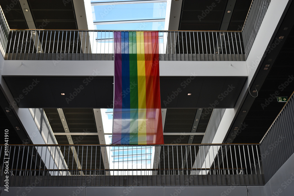 pride flag hanging in a corporation hall to support and celebrate the ...