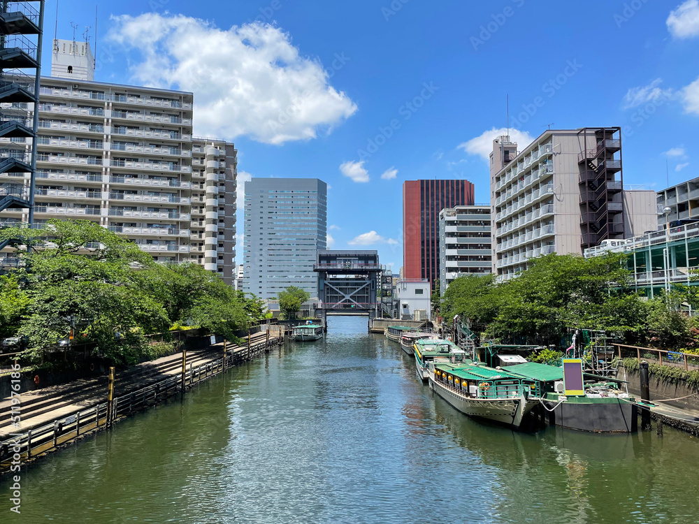 Nostalgic houseboats and the water gate floating on the canals of Tokyo ...
