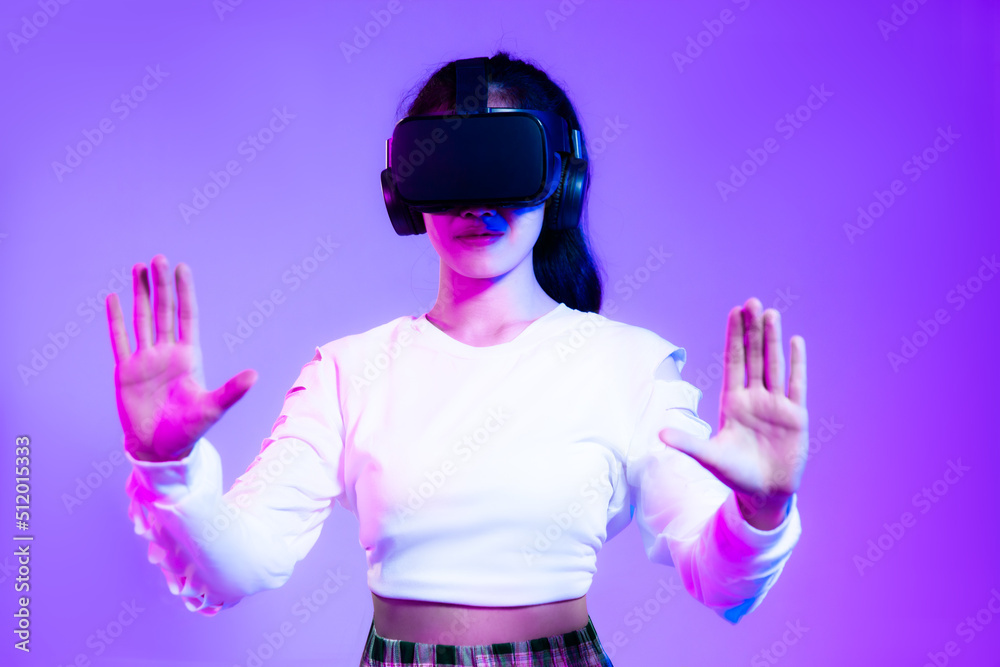 Young asian girl in wearing vr headset watching playing and hands ...