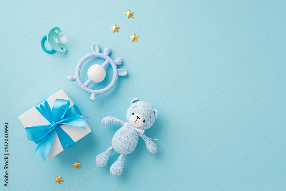 Baby boy concept. Top view photo of giftbox soother rattle knitted ...