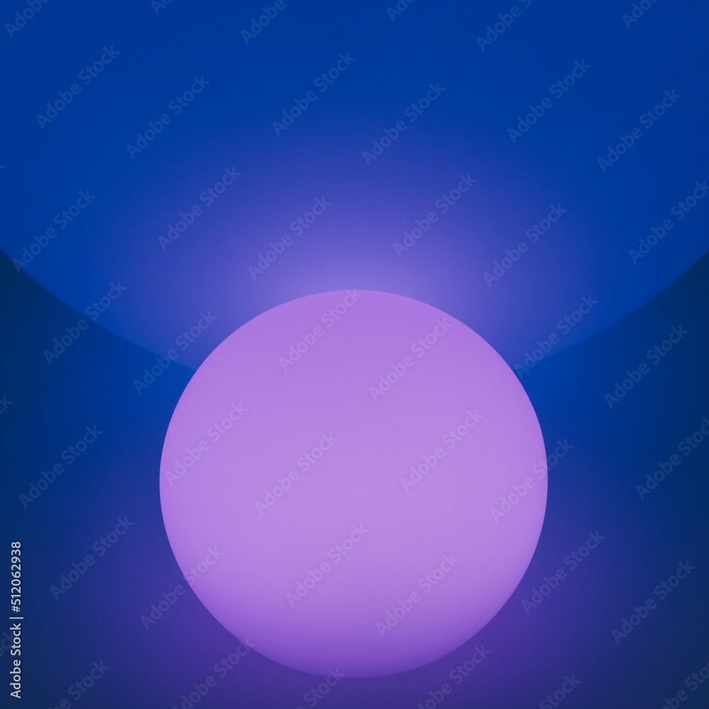 Glowing and illuminated spherical coloured orbs on a black background. Stock Photo | Adobe Stock