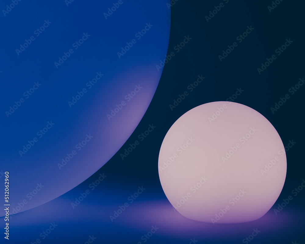 Glowing and illuminated spherical coloured orbs on a black background. Stock Photo | Adobe Stock