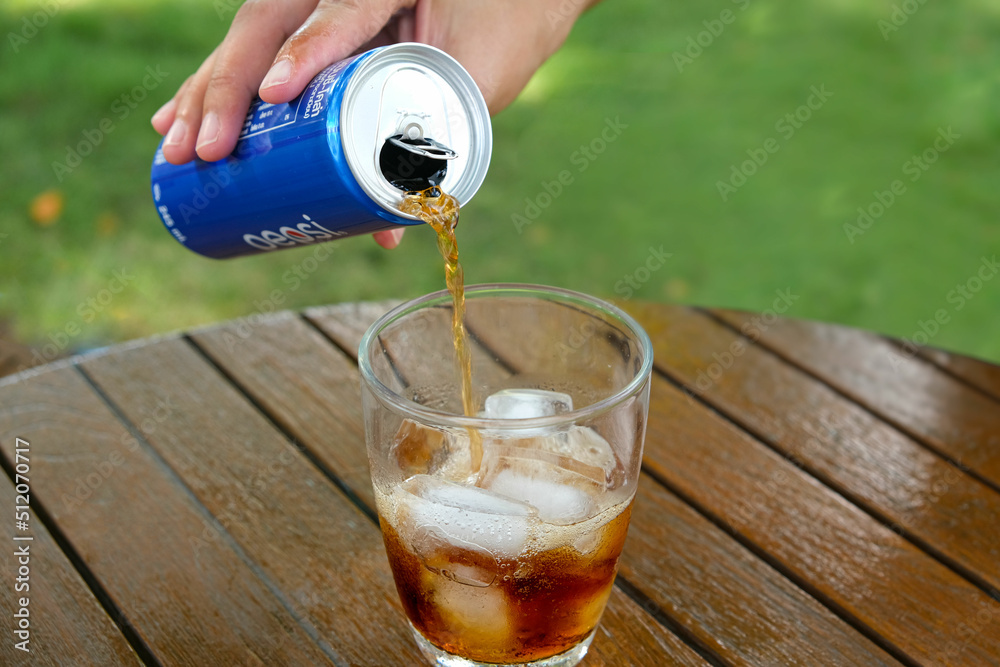 Bangkok, Thailand : June 20,2022: Thirsty man is opening a pepsi can ...