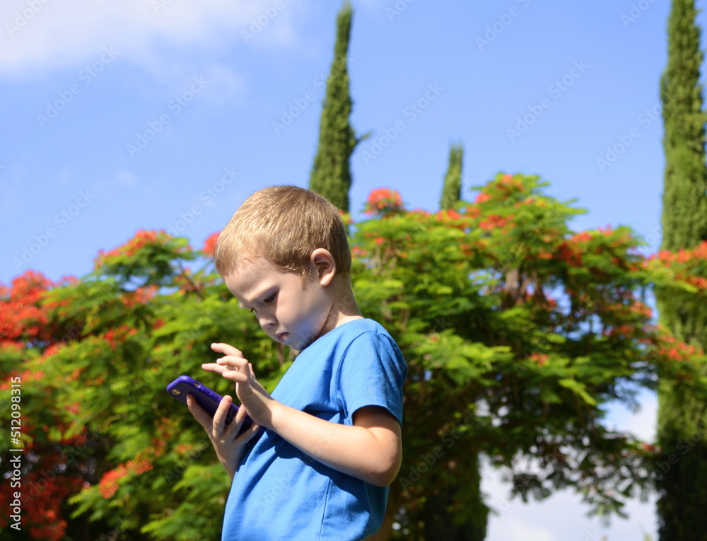 Portrait of a boy with a phone. Children and smartphone. Child in the ...