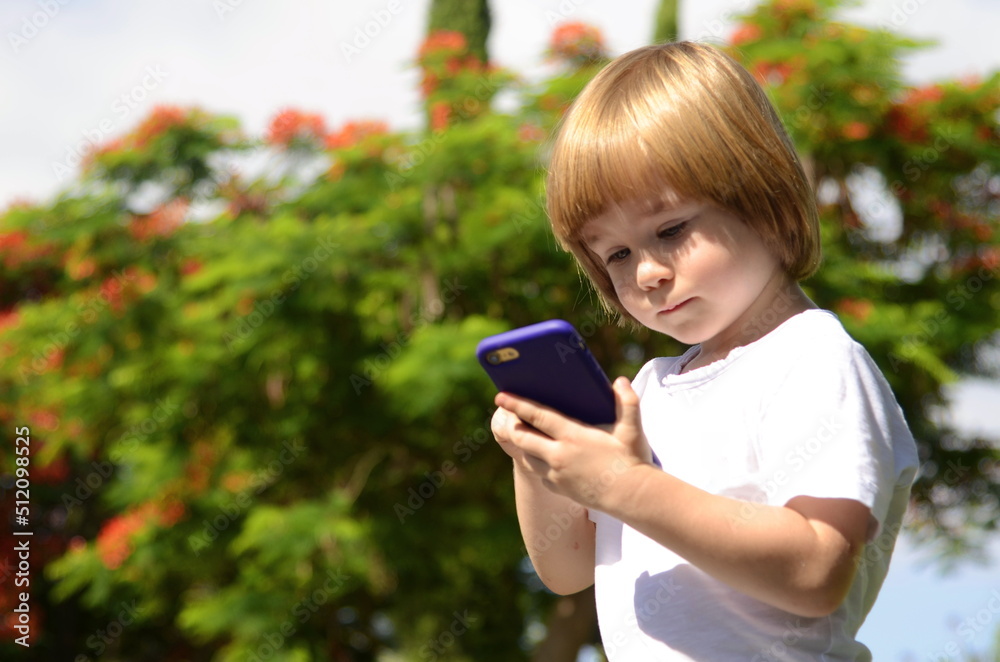 Portrait of a boy with a phone. Children and smartphone. Child in the ...