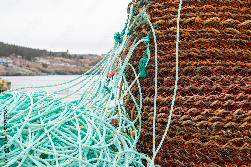 Multiple stacks of industrial crab traps or pots for commercial fishing ...