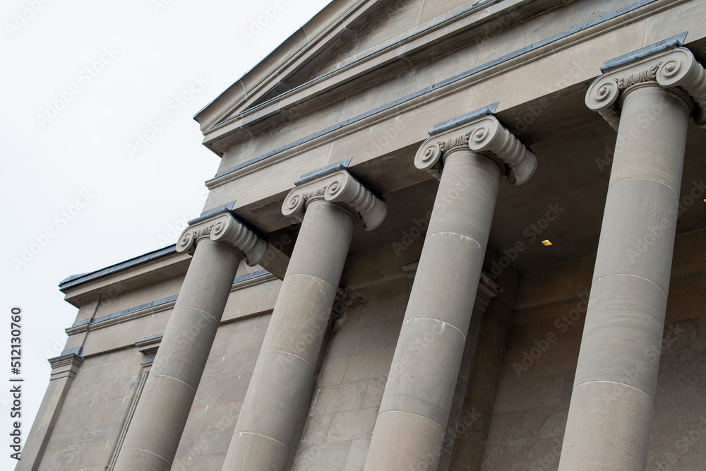 The exterior of a large courthouse with columns and pillars at the ...