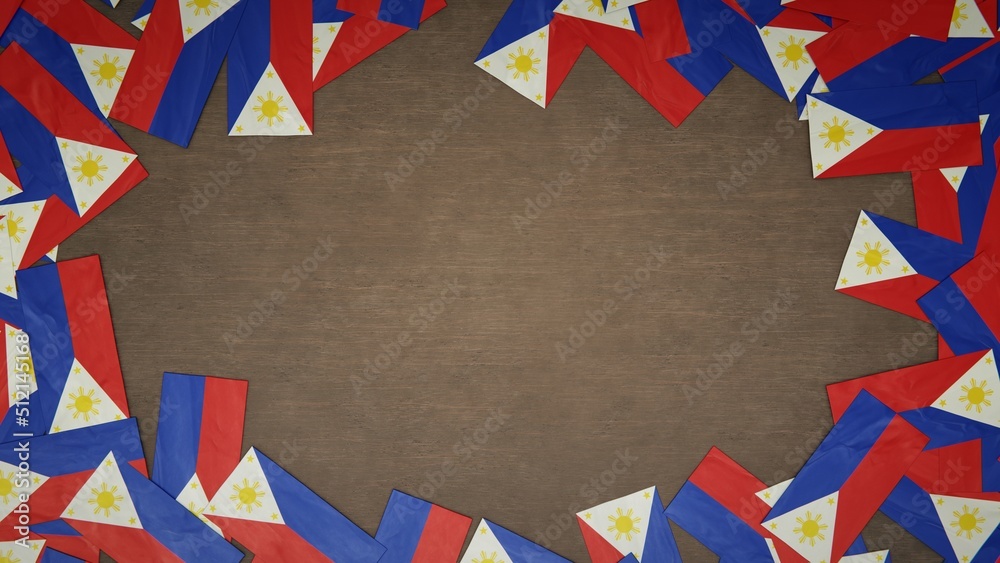 Frame made of paper flags of the Philippines arranged on wooden table ...