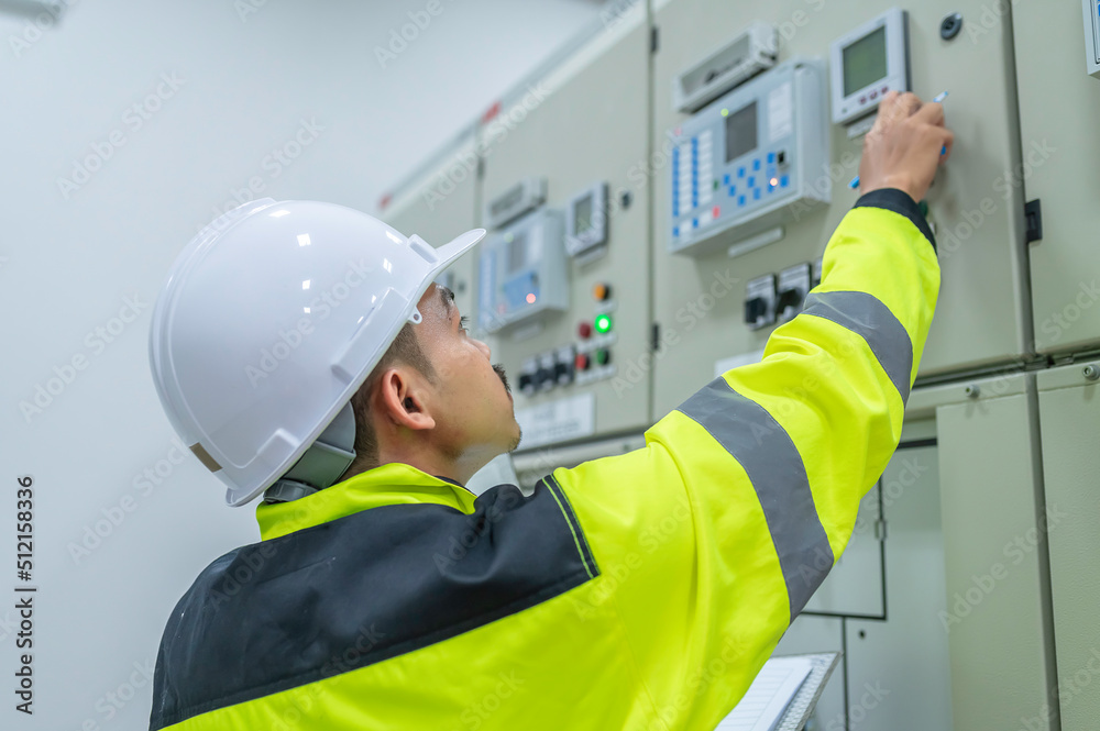 Electrical engineer man checking voltage at the Power Distribution ...