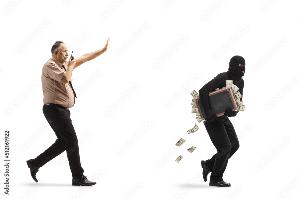 Full length profile shot of a security officer chasing a burgler ...