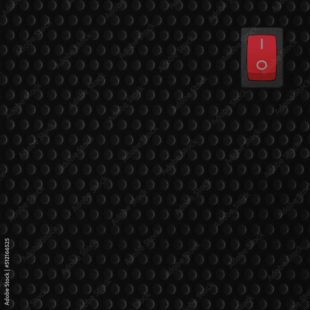 Red rectangle rocker power switch in on position, black abstract dot ...